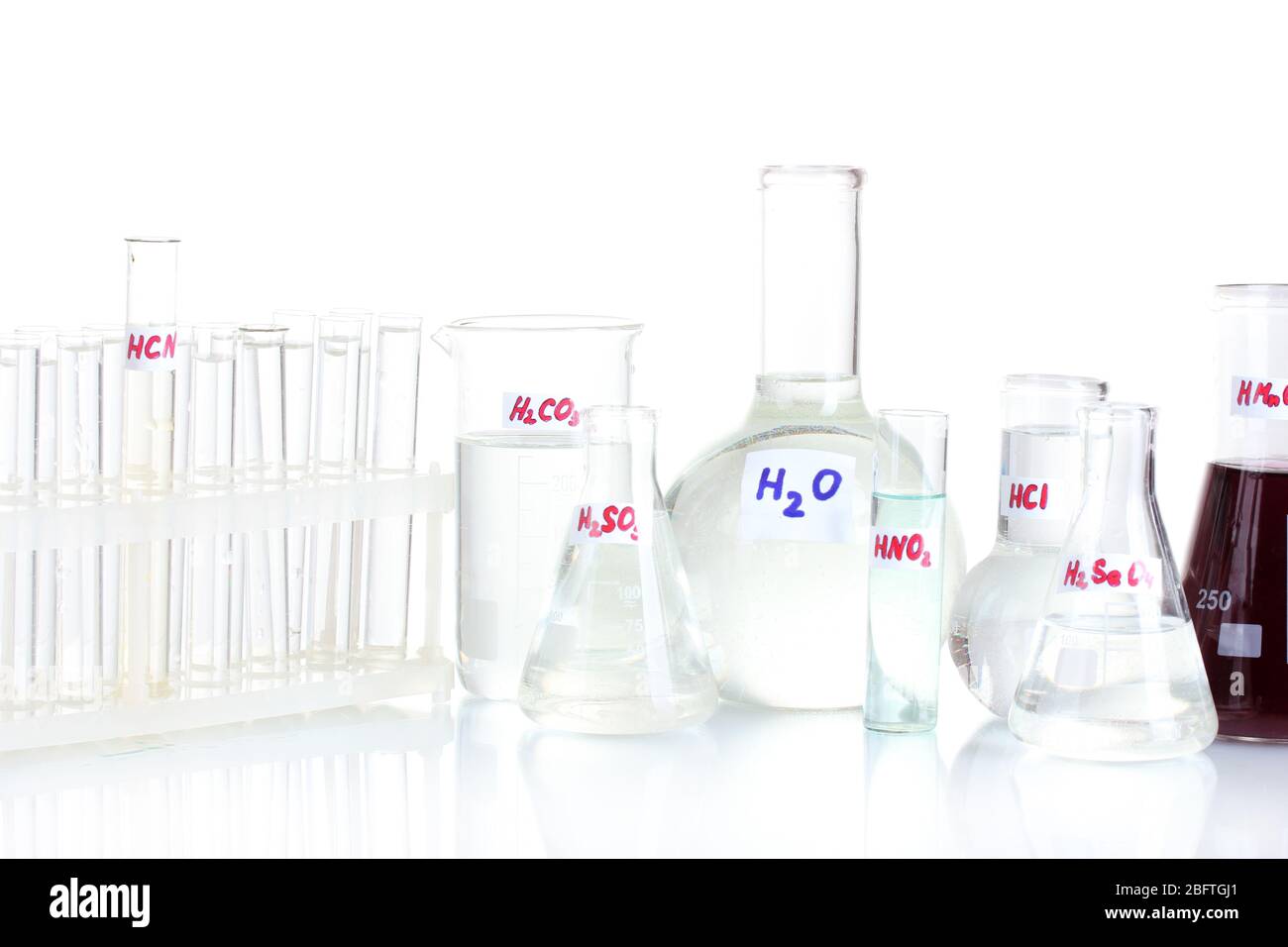 Test-tubes with various acids isolated on white Stock Photo - Alamy