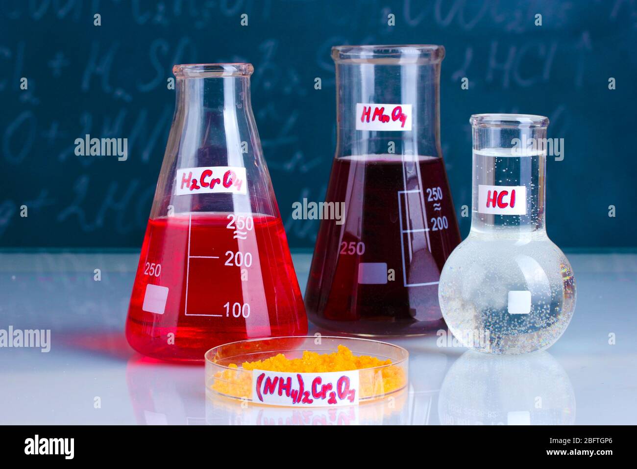 Test-tubes with various acids and other chemicals on the background of ...