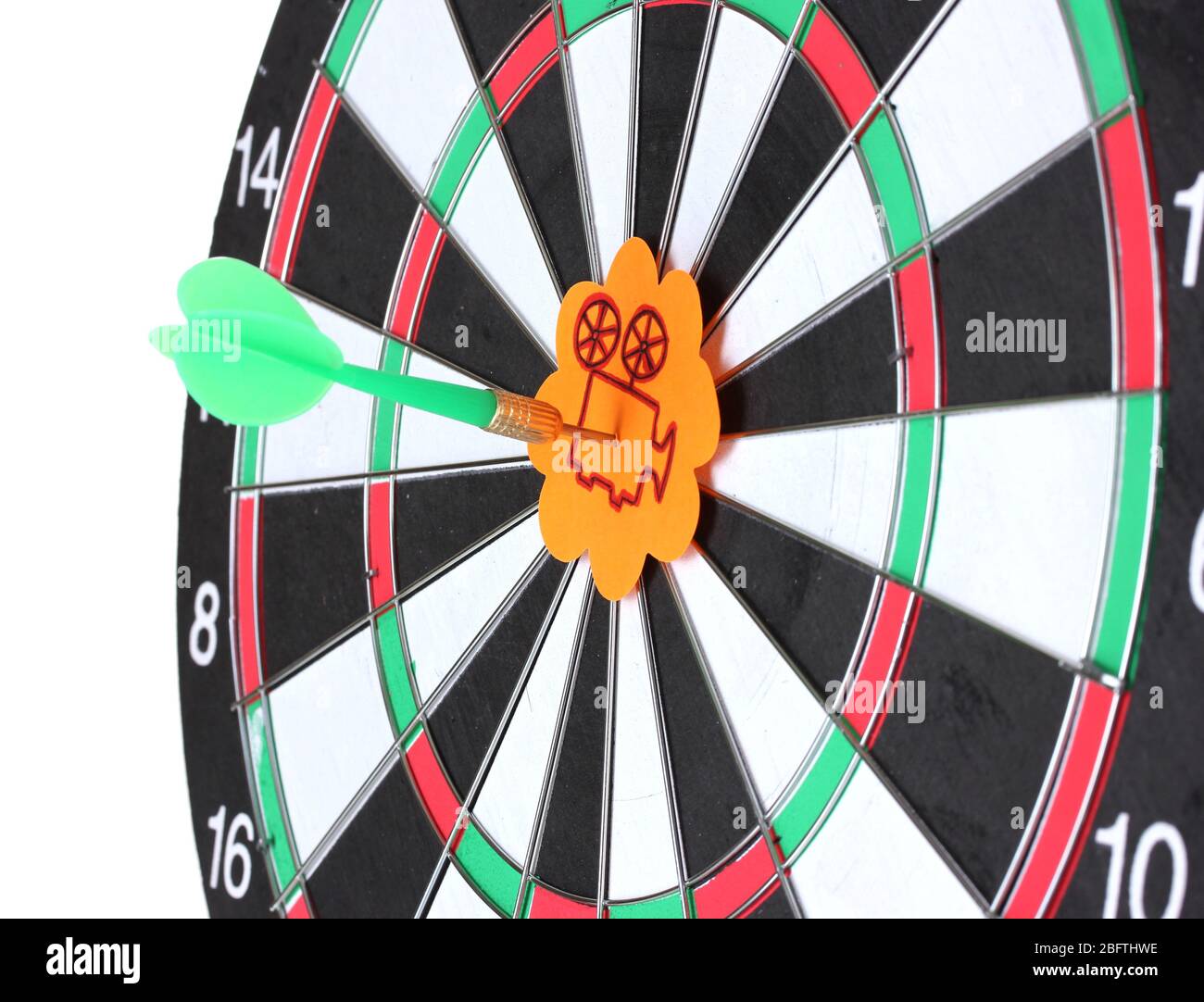 Darts with stickers depicting the life values close-up on white ...