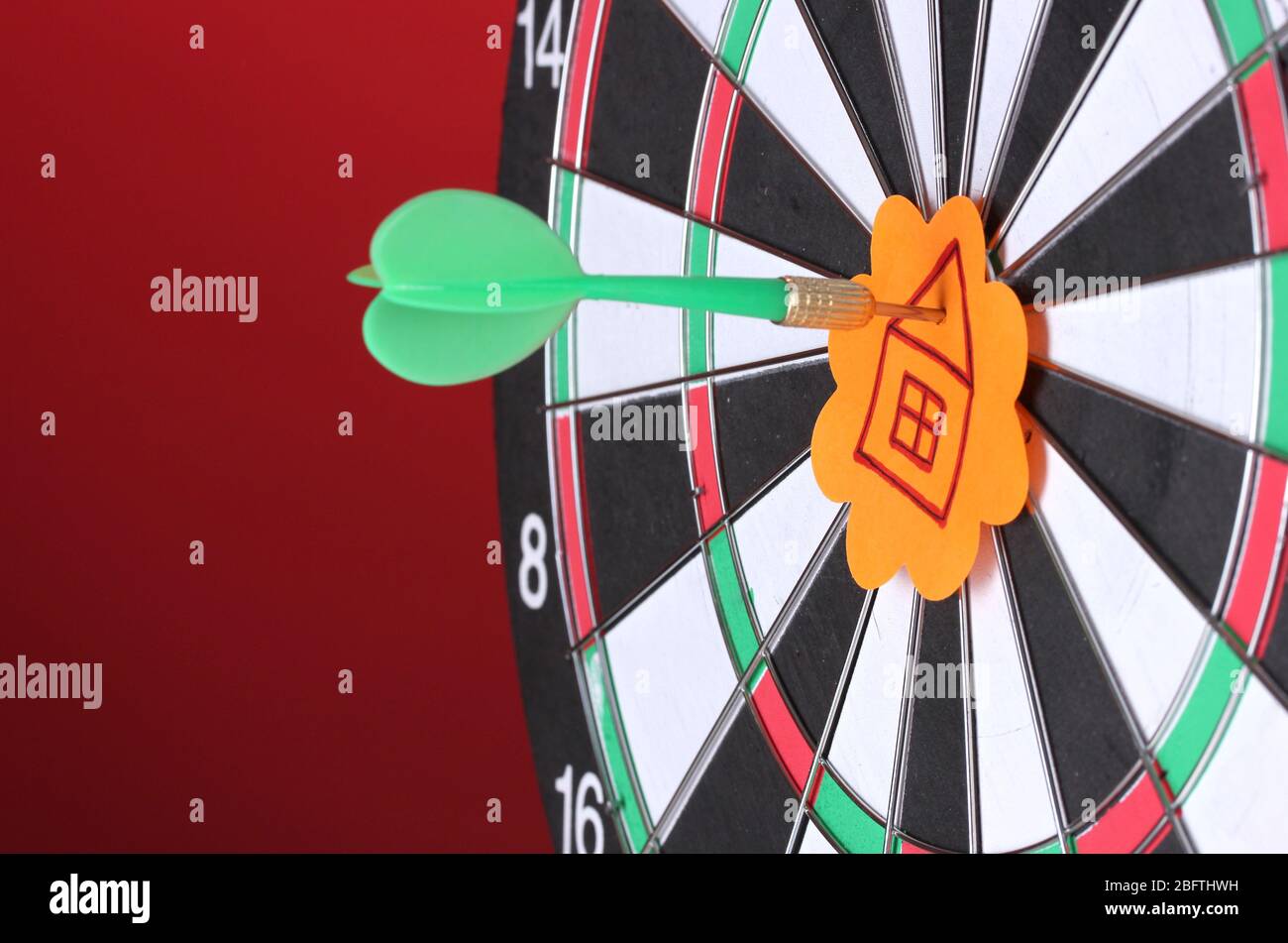 Darts with stickers depicting the life values close-up on colorful ...