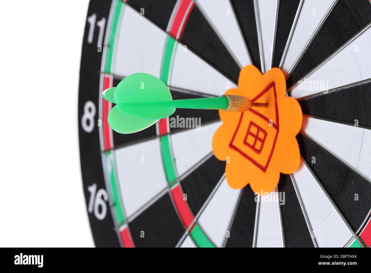 Darts with stickers depicting the life values close-up on white ...