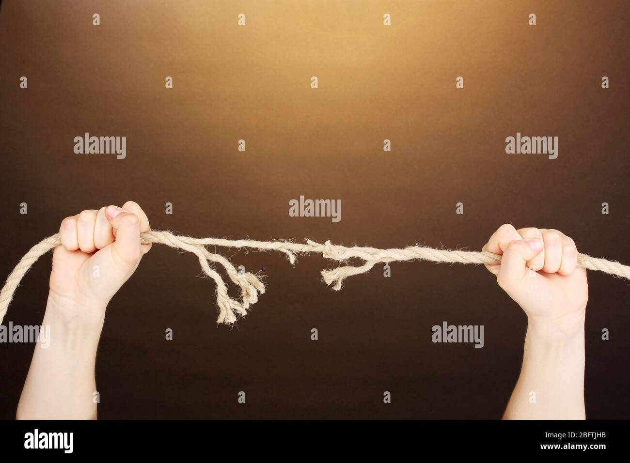 Hands breaking rope hi-res stock photography and images - Alamy