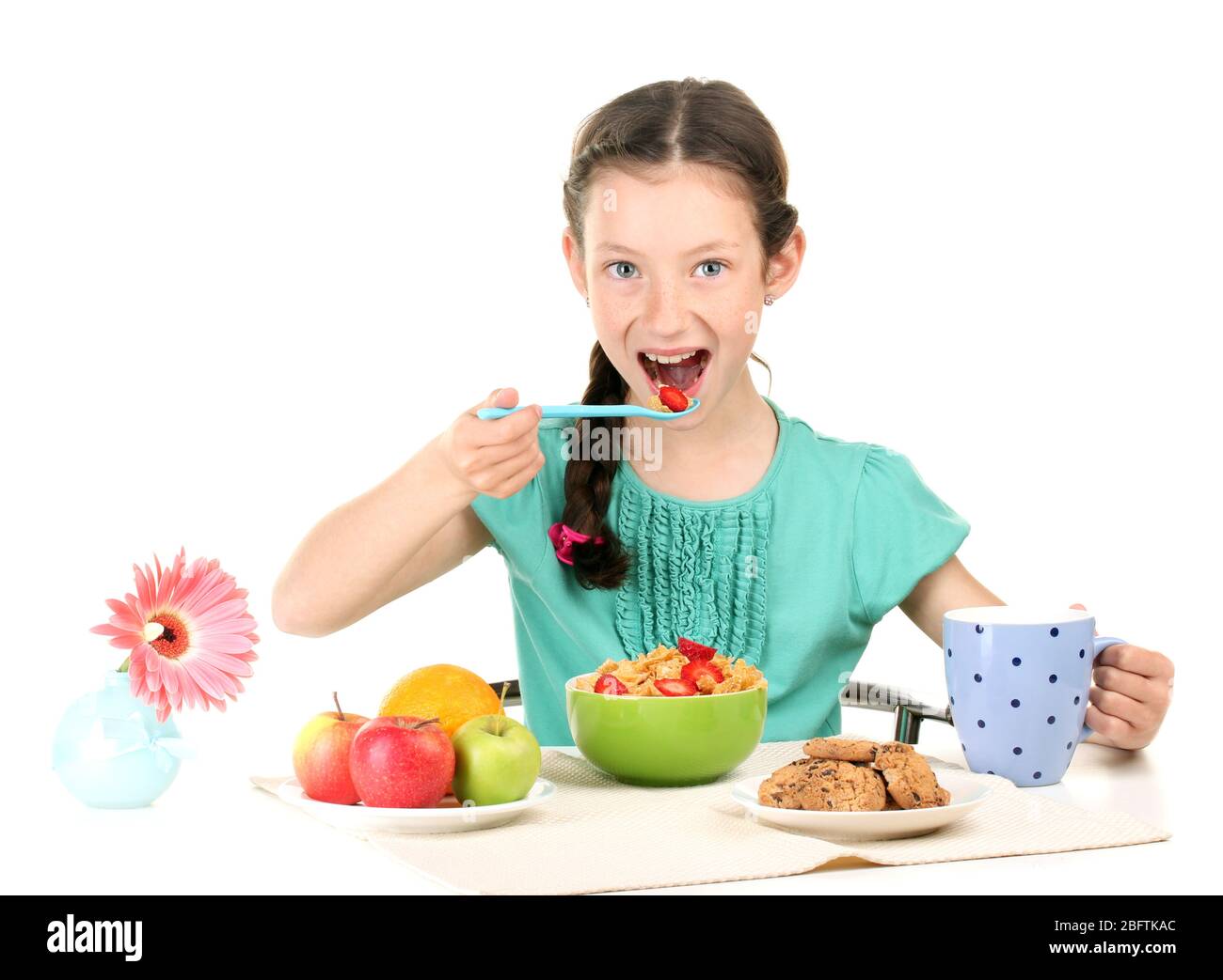 little beautiful girl have a breakfast on white background Stock Photo ...