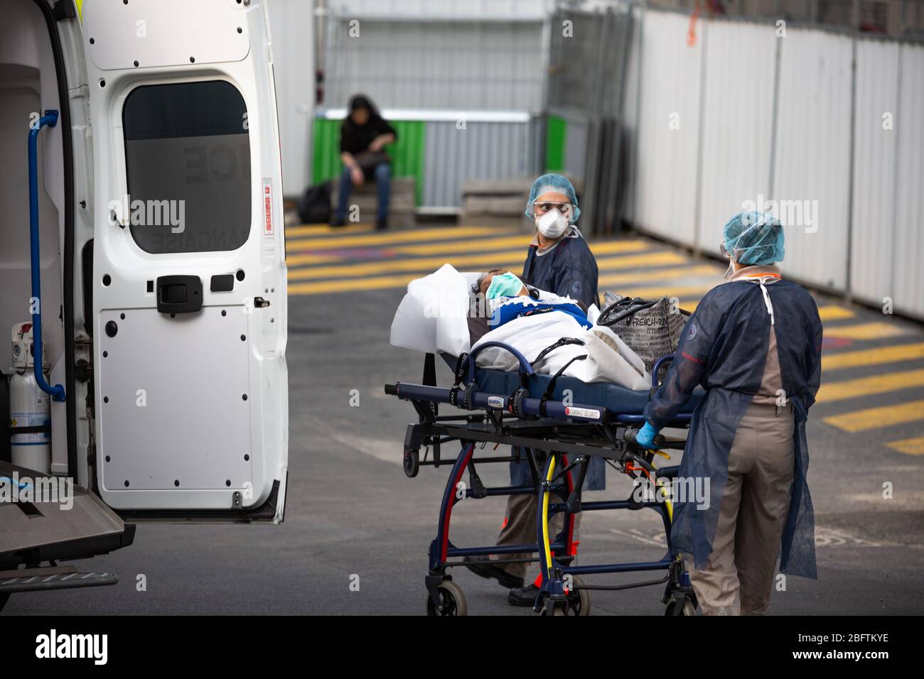 Paris, France. 16th Apr, 2020. Two Red Cross paramedics bring a sick ...