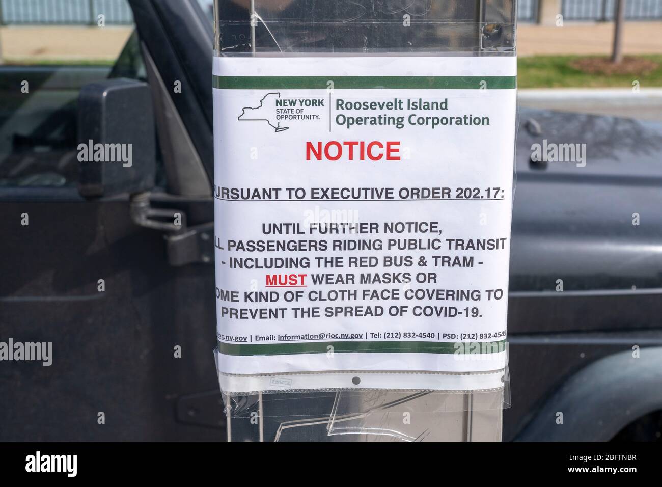 NEW YORK, NY - APRIL 19: A must wear mask on bus sign is seen on a bus ...
