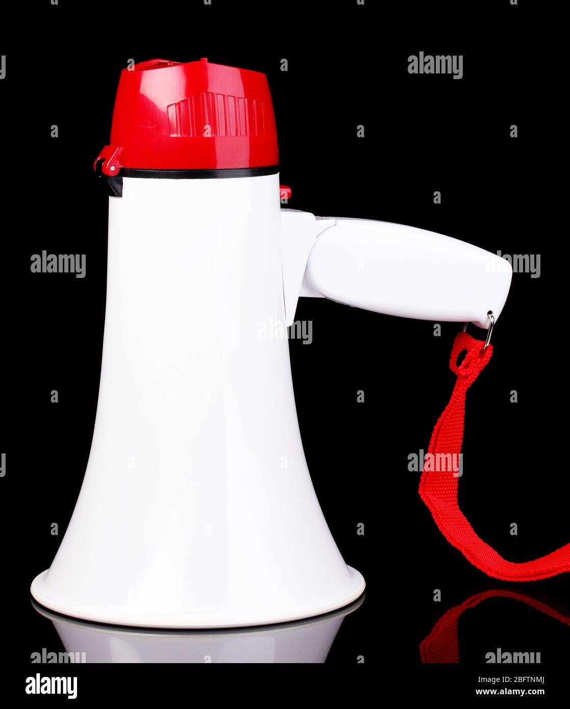 red and white megaphone isolated on black Stock Photo - Alamy