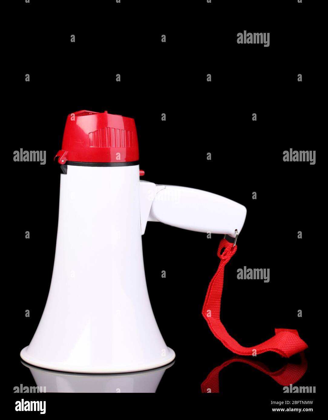 red and white megaphone isolated on black Stock Photo - Alamy