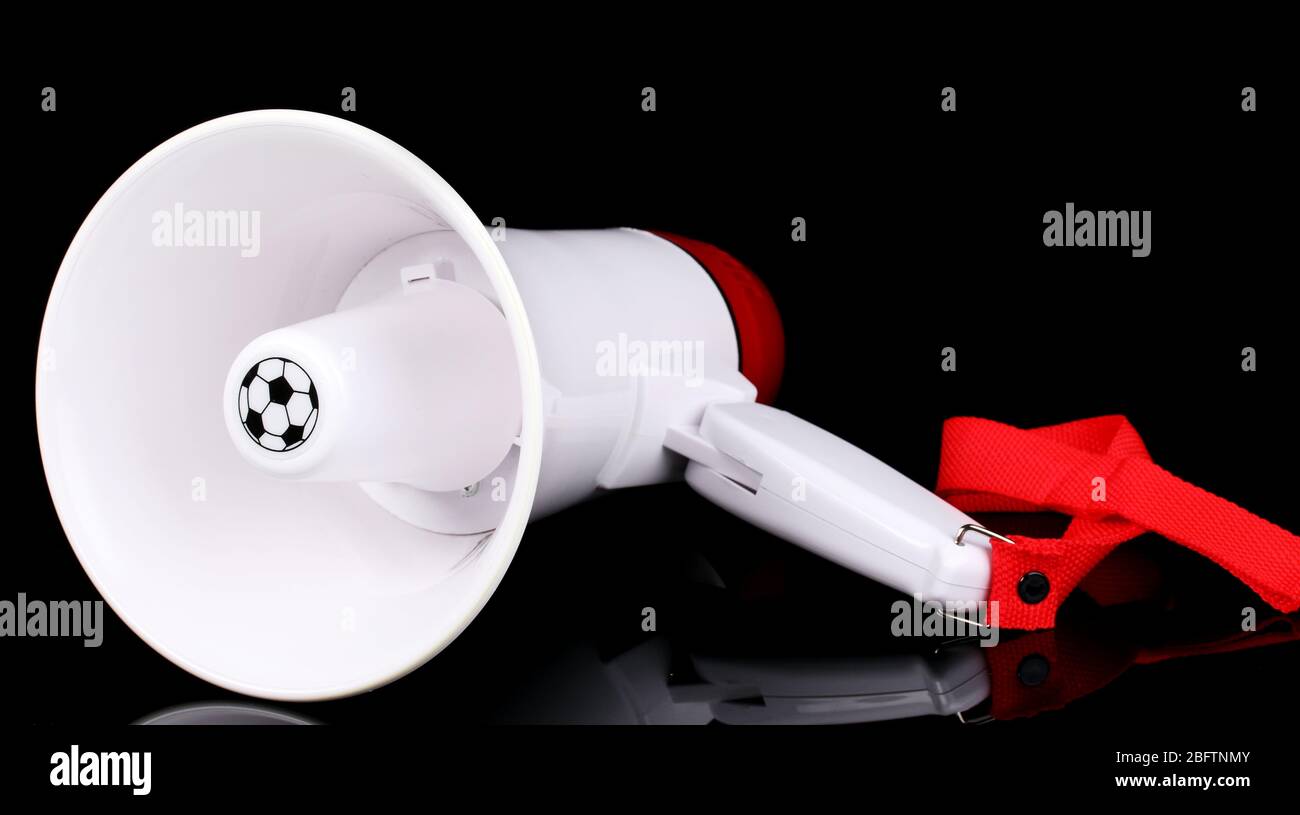 red and white megaphone isolated on black Stock Photo - Alamy