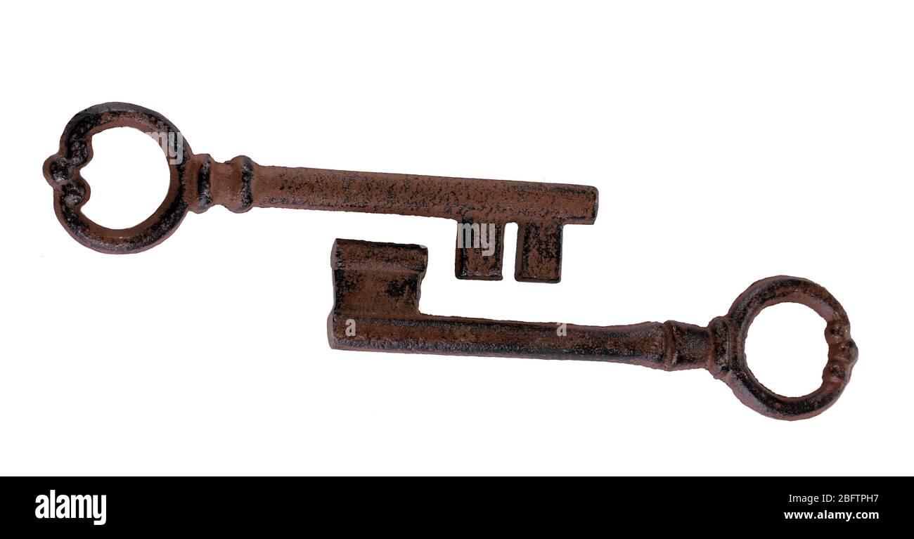 Two antique keys isolated on white Stock Photo - Alamy