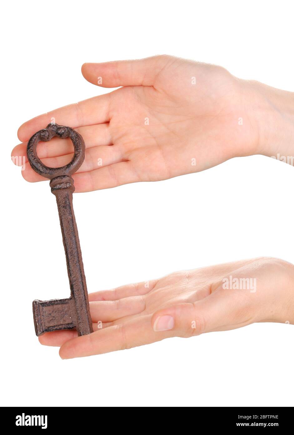 woman's hand holding an antique key on white background Stock Photo - Alamy