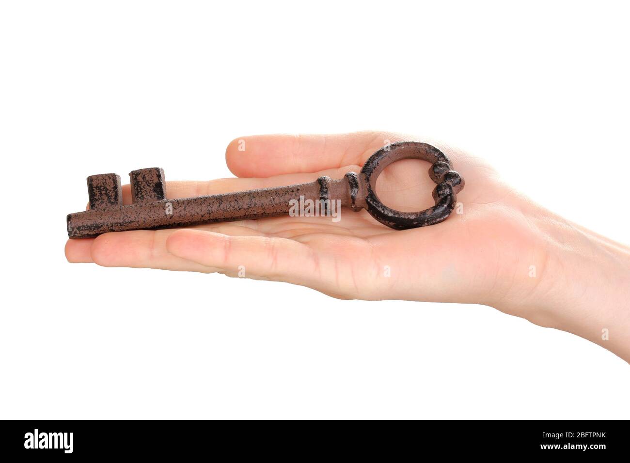 woman's hand holding an antique key on white background Stock Photo - Alamy