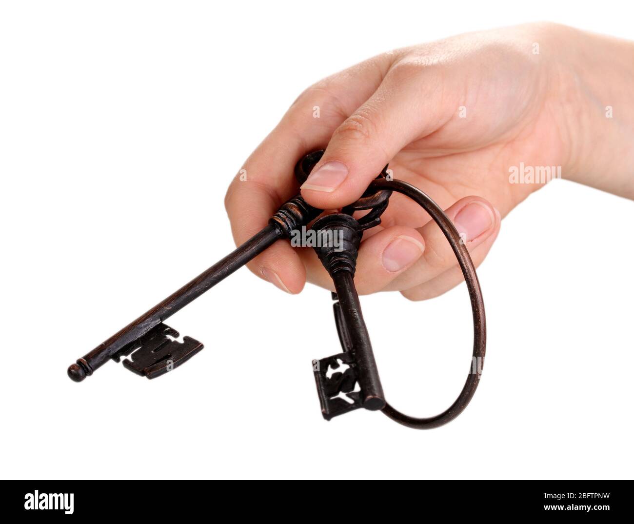 woman's hand holding a bunch of antique keys on white background Stock ...