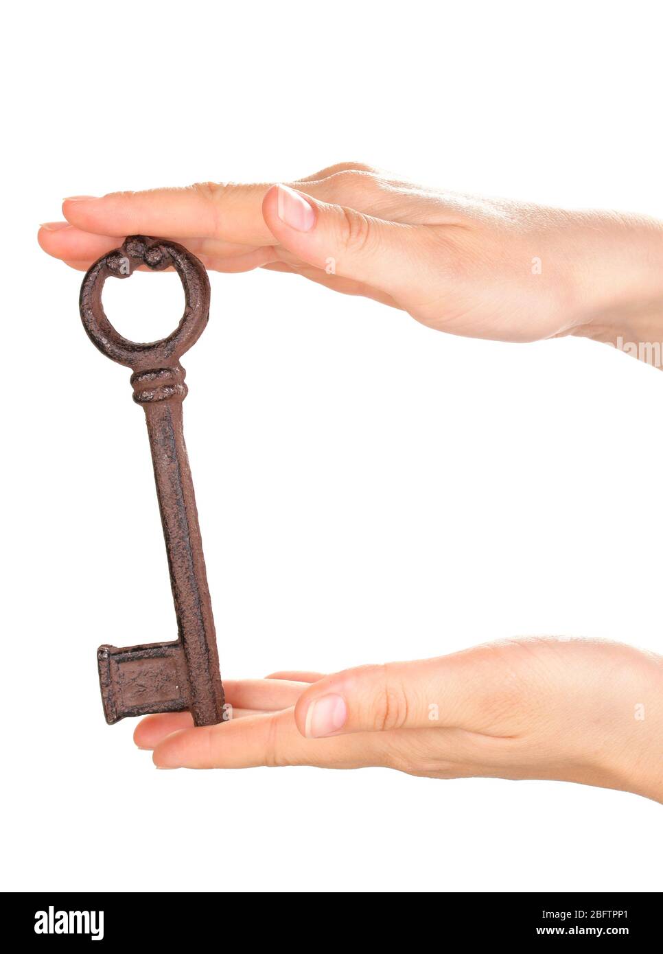 woman's hand holding an antique key on white background Stock Photo - Alamy