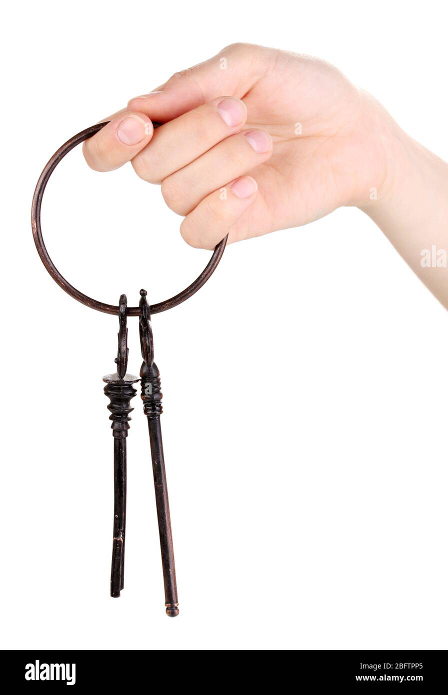 woman's hand holding a bunch of antique keys on white background Stock ...
