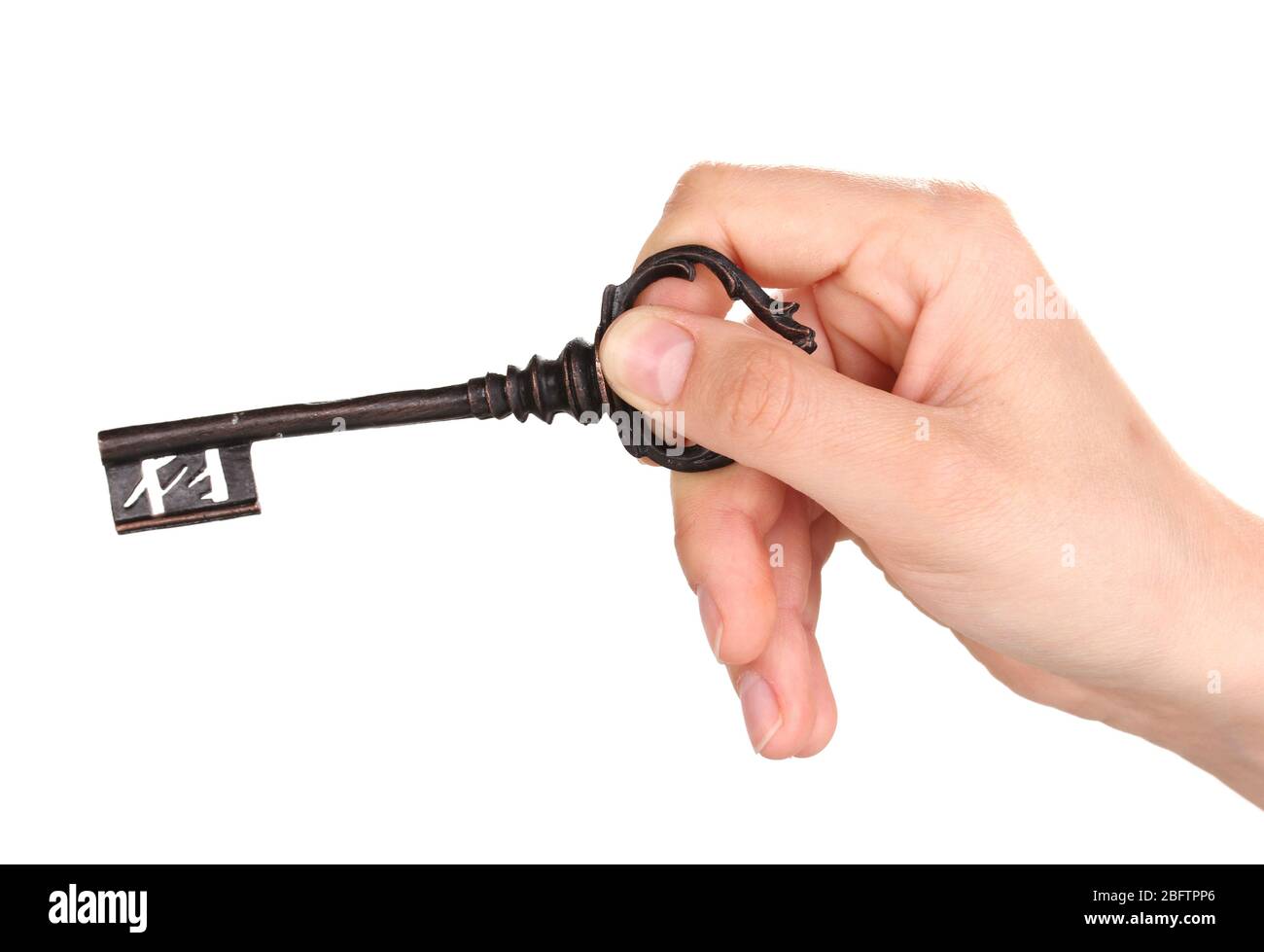 woman's hand holding an antique key on white background Stock Photo - Alamy
