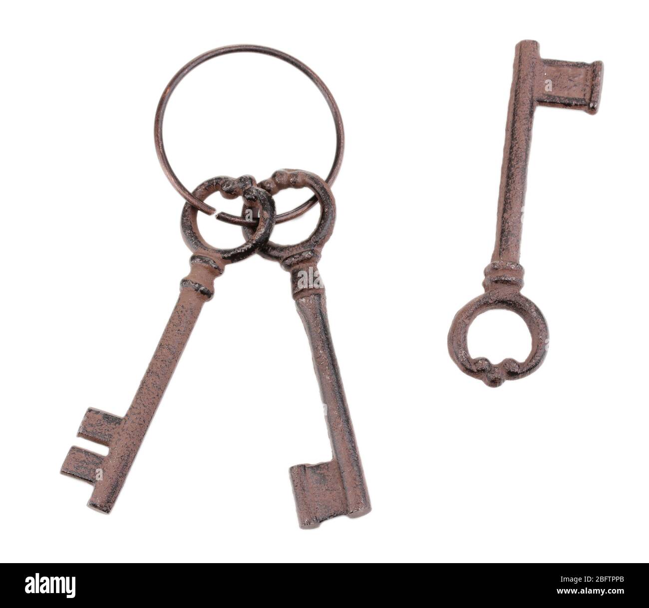 a bunch of antique keys and one single key isolated on white Stock ...