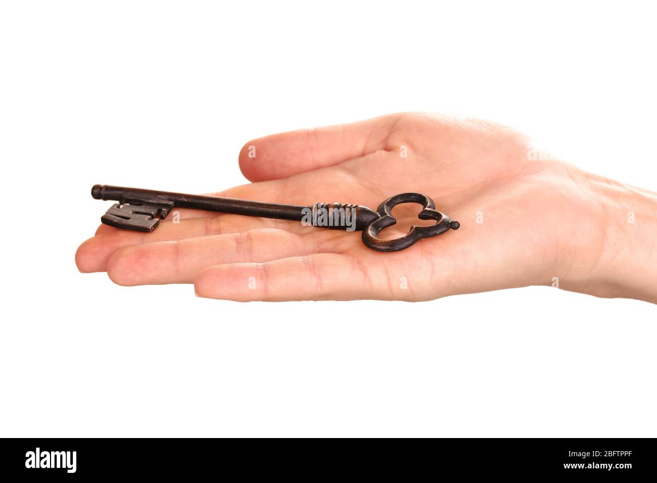 woman's hand holding an antique key on white background Stock Photo - Alamy