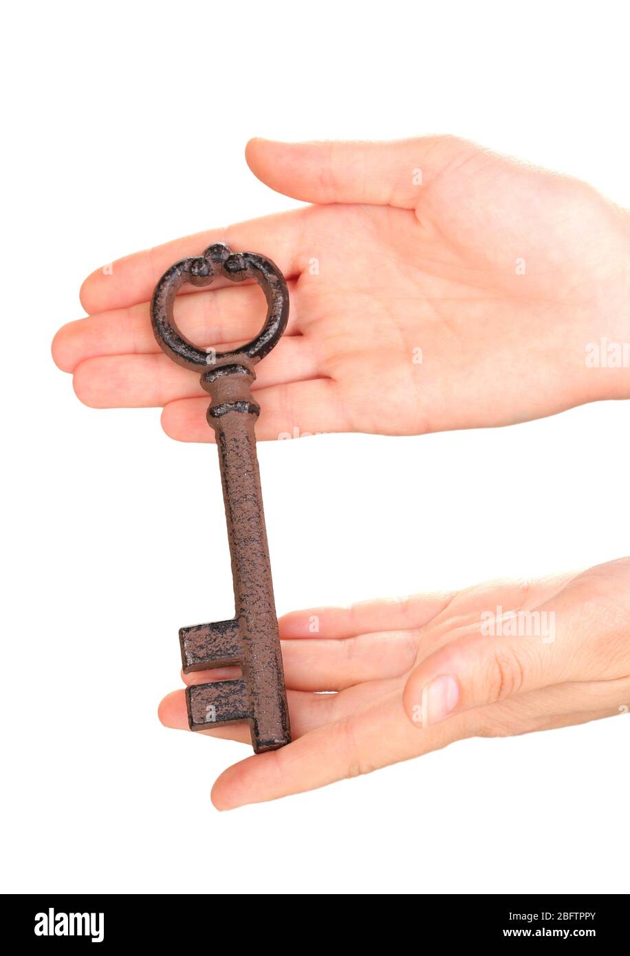woman's hand holding an antique key on white background Stock Photo - Alamy