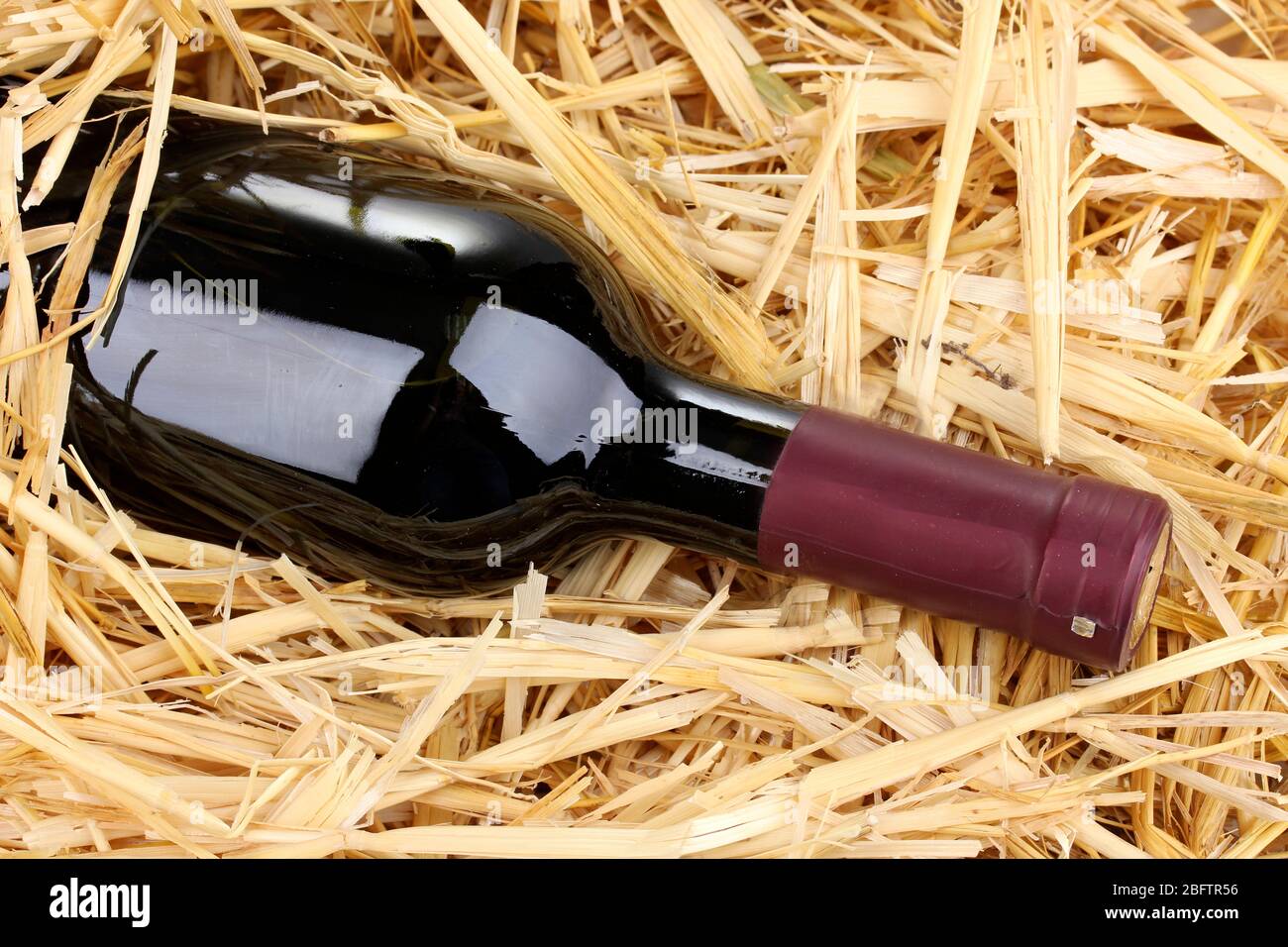 Bottle of great wine on hay Stock Photo - Alamy