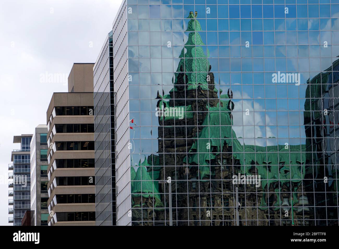 reflections on a glass tower in downtown Ottawa Stock Photo - Alamy