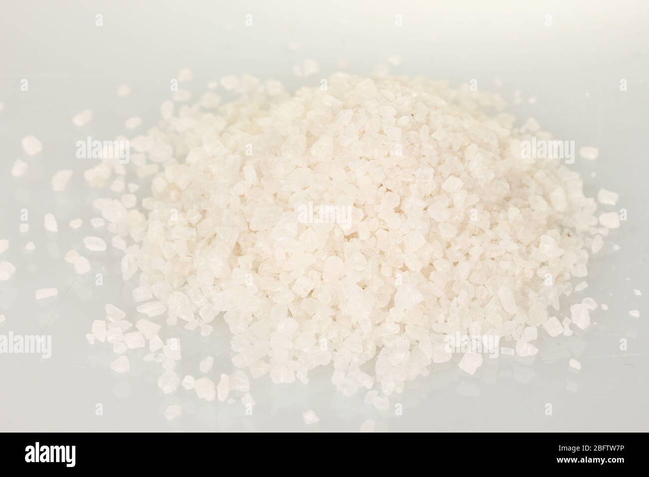 Lots of sea salt isolated on white Stock Photo - Alamy