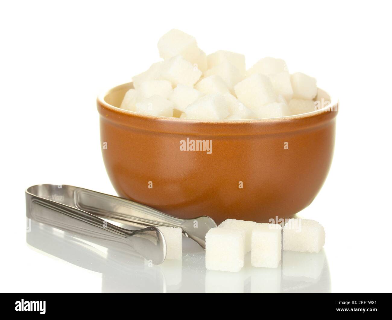 Lump sugar in bowl with sugar-tongs isolated on white Stock Photo - Alamy