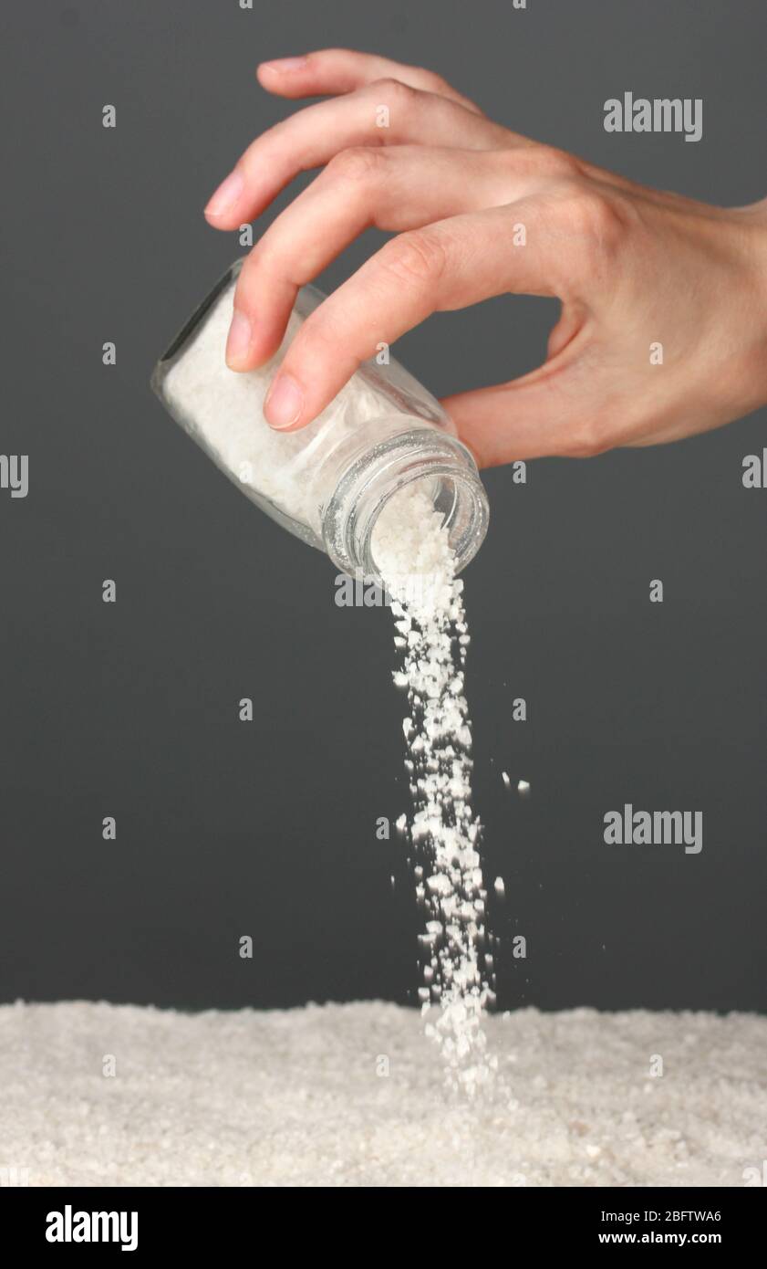 Hand holding salt hi-res stock photography and images - Alamy