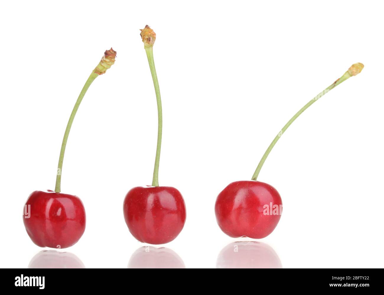 Ripe cherry berries isolated on white Stock Photo - Alamy