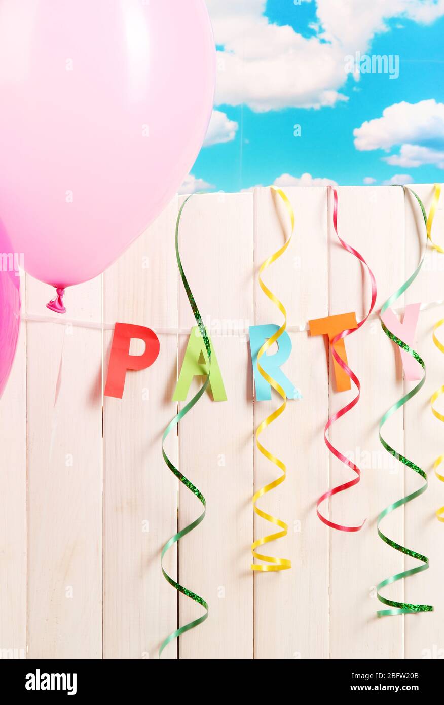 Balloons by wooden fence hi-res stock photography and images - Alamy