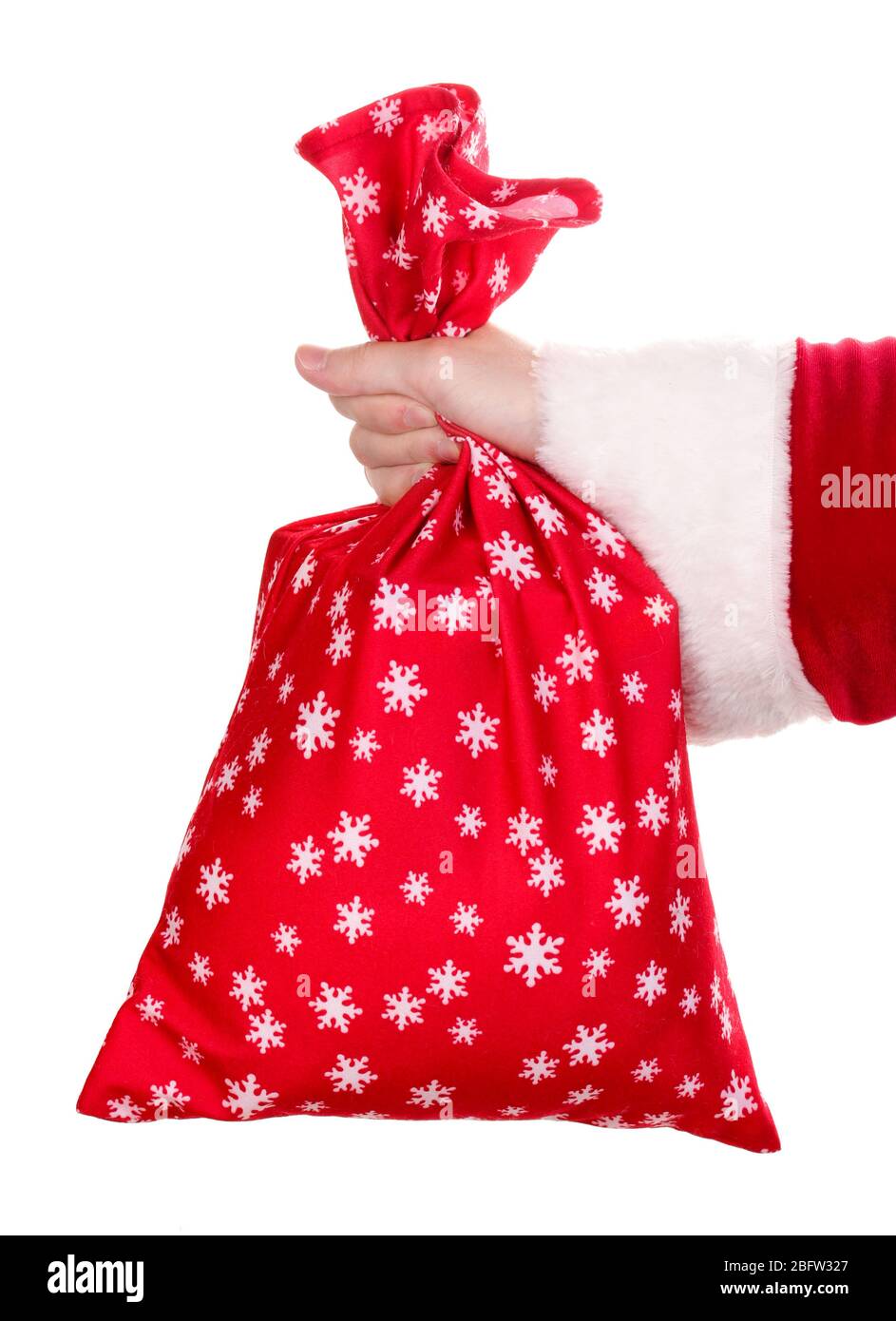 Santa Claus hand holding bag of gifts isolated on white Stock Photo - Alamy