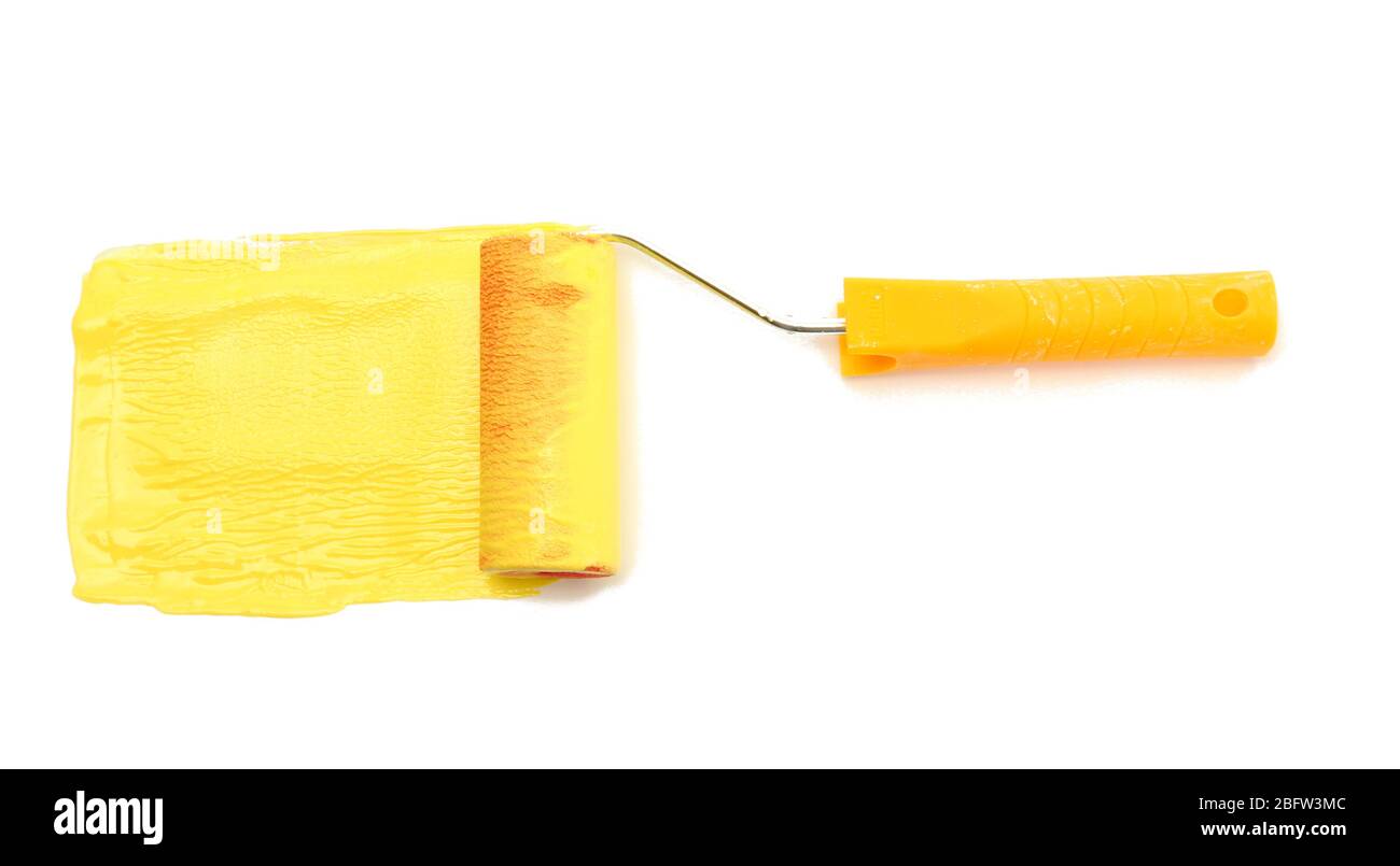Paint roller with yellow paint isolated on white Stock Photo - Alamy