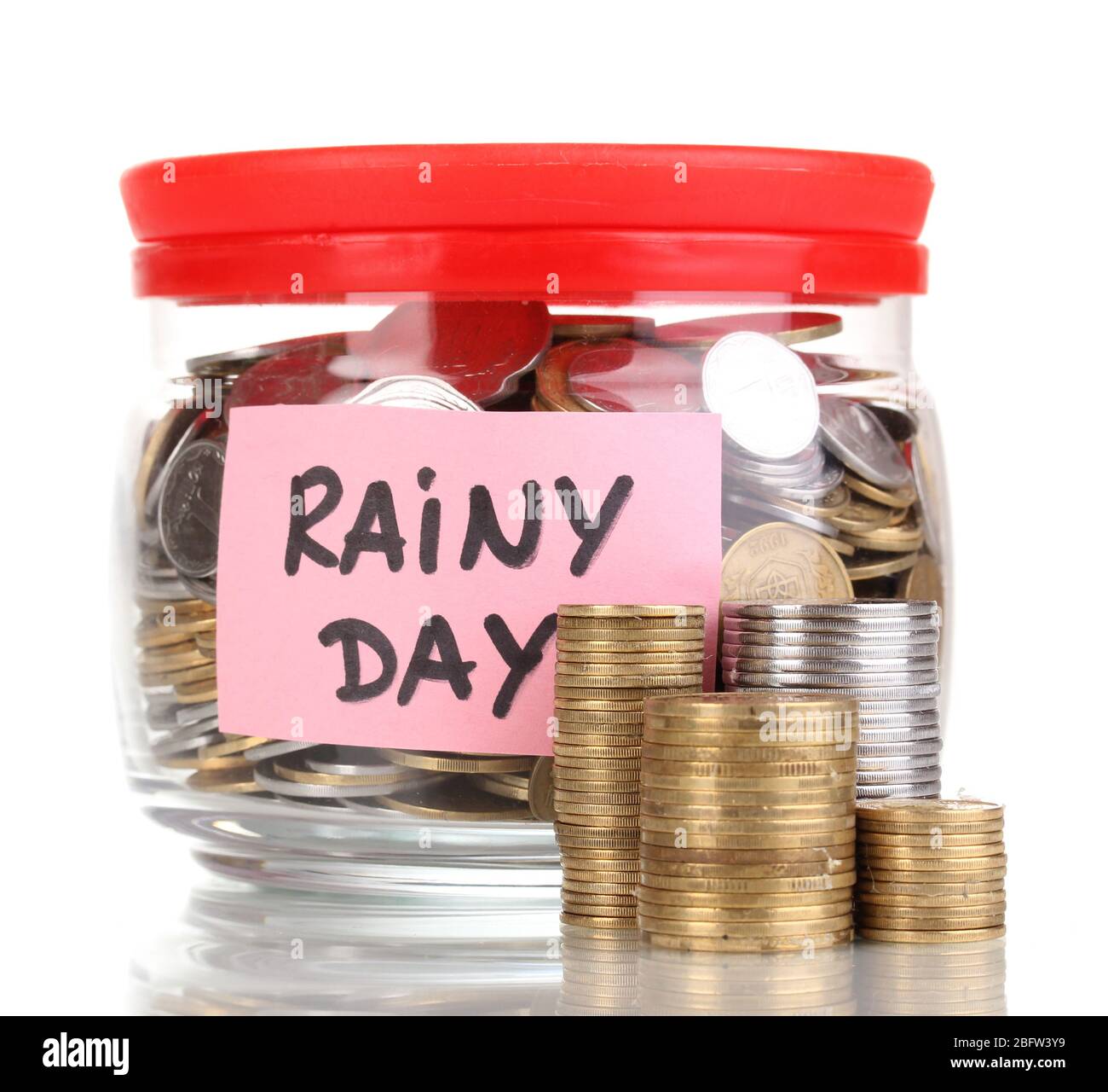 Glass bank for tips with money isolated on white Stock Photo - Alamy