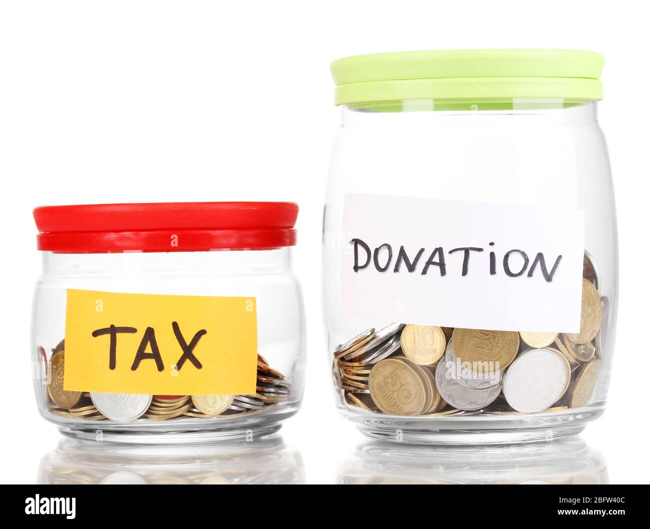 Glass banks for tips with money isolated on white Stock Photo - Alamy