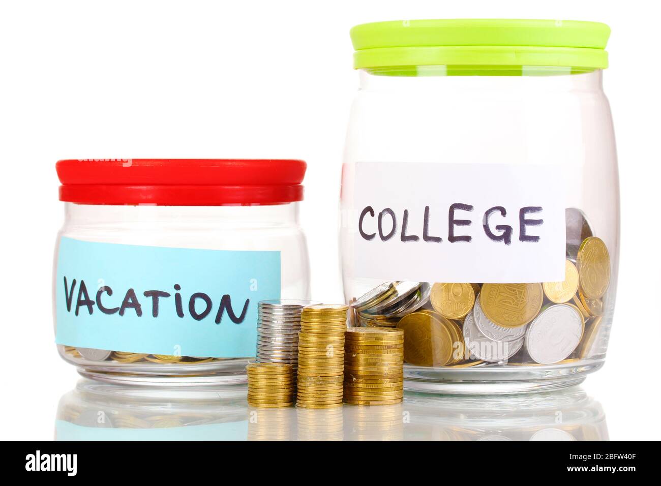 Glass banks for tips with money isolated on white Stock Photo - Alamy