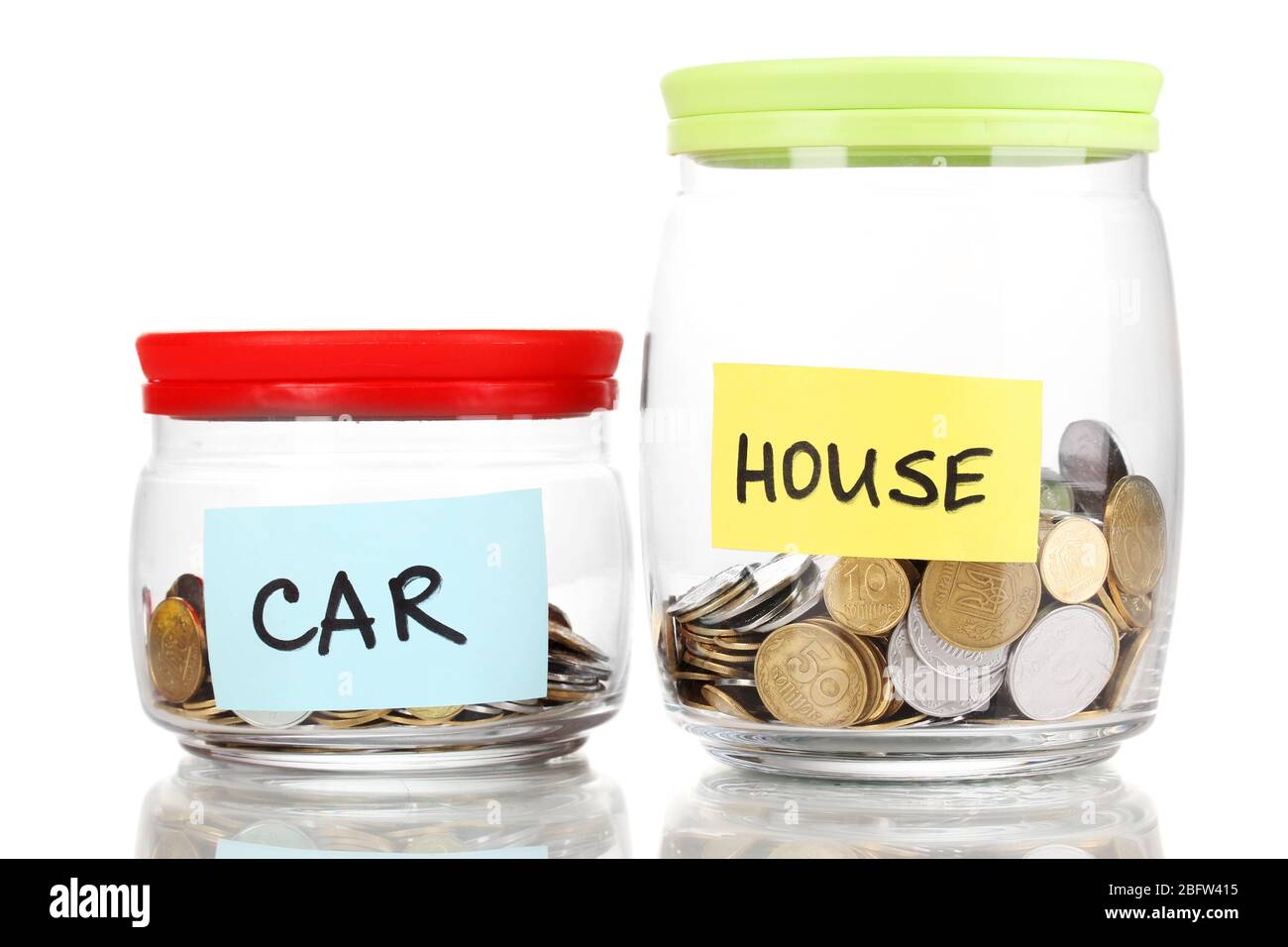 Glass banks for tips with money isolated on white Stock Photo - Alamy