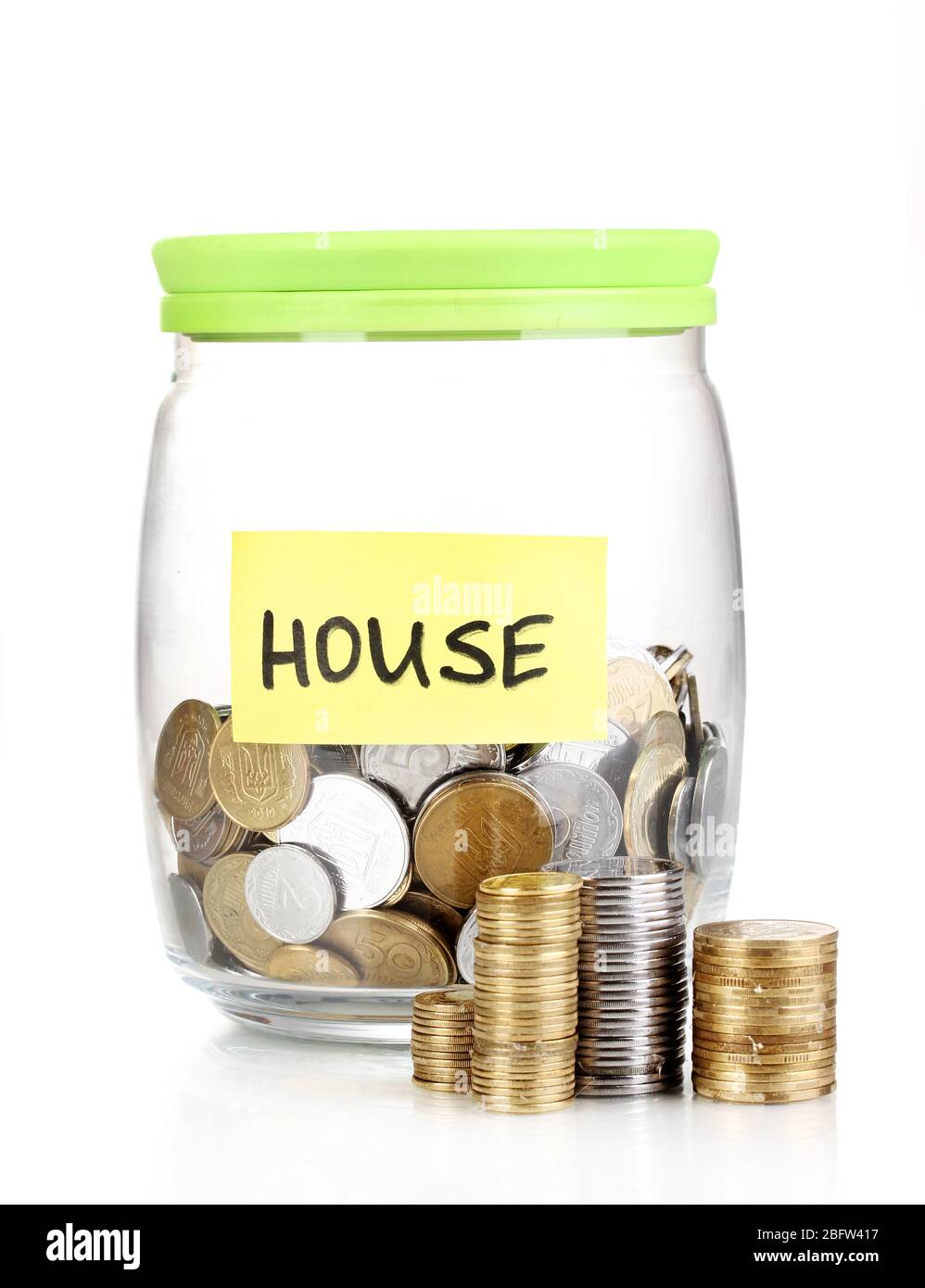 Glass bank for tips with money isolated on white Stock Photo - Alamy