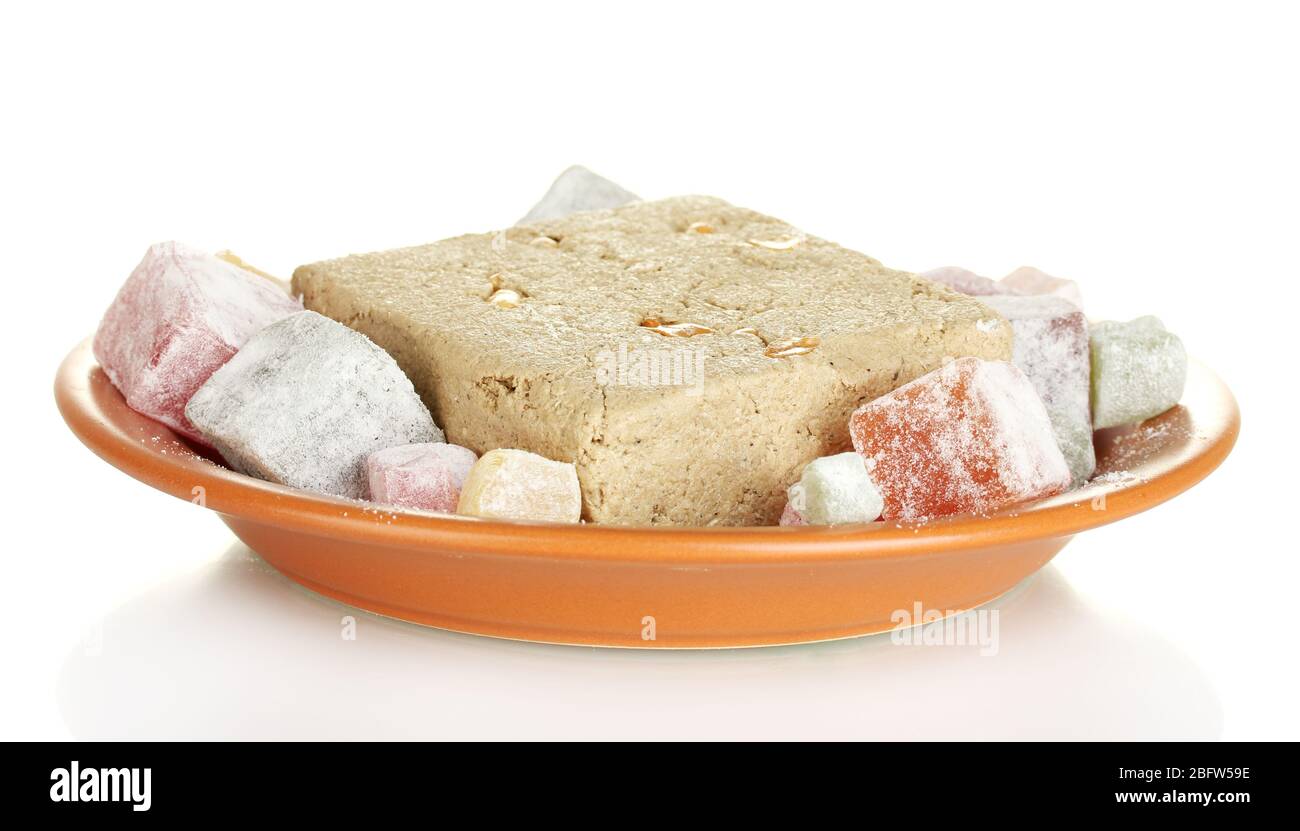 tasty halva and turkish delight in the plate isolated on white close-up ...