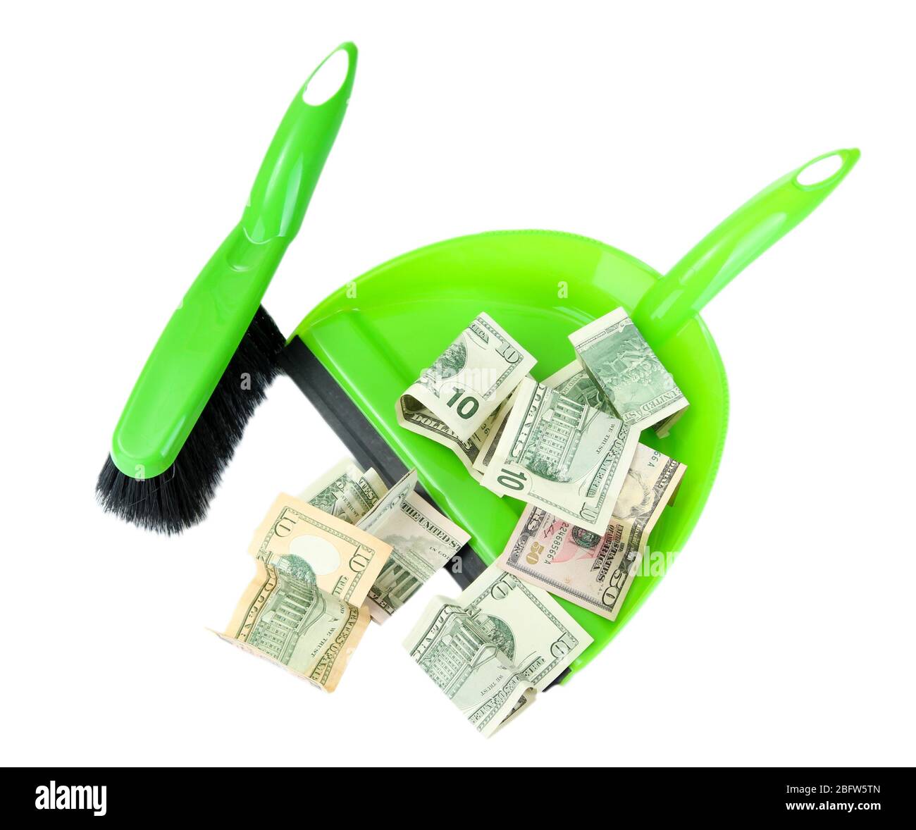 Sweeps money in the shovel on white background close-up Stock Photo - Alamy