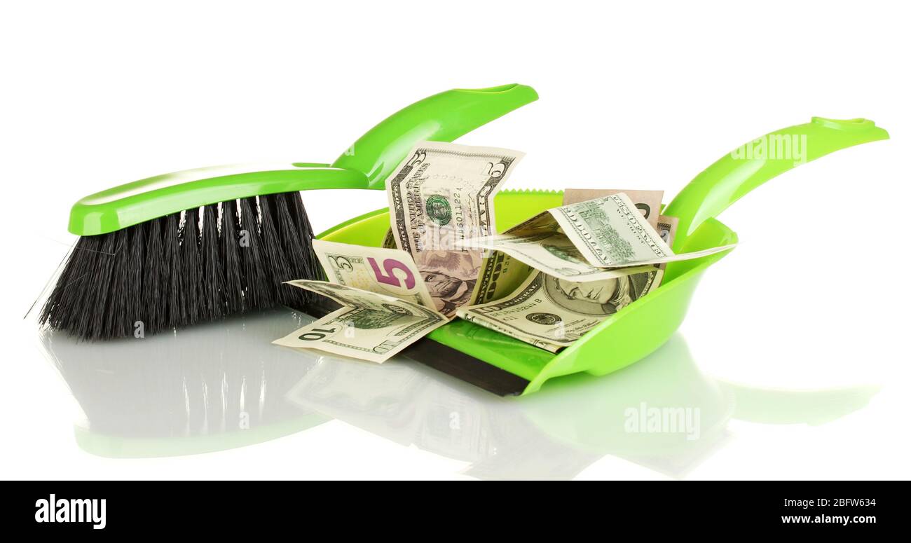 Sweeps money in the shovel on white background close-up Stock Photo - Alamy