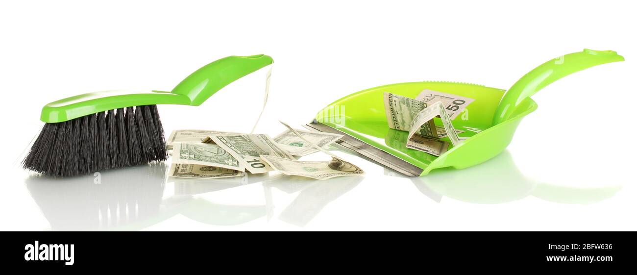 Sweeps money in the shovel on white background close-up Stock Photo - Alamy