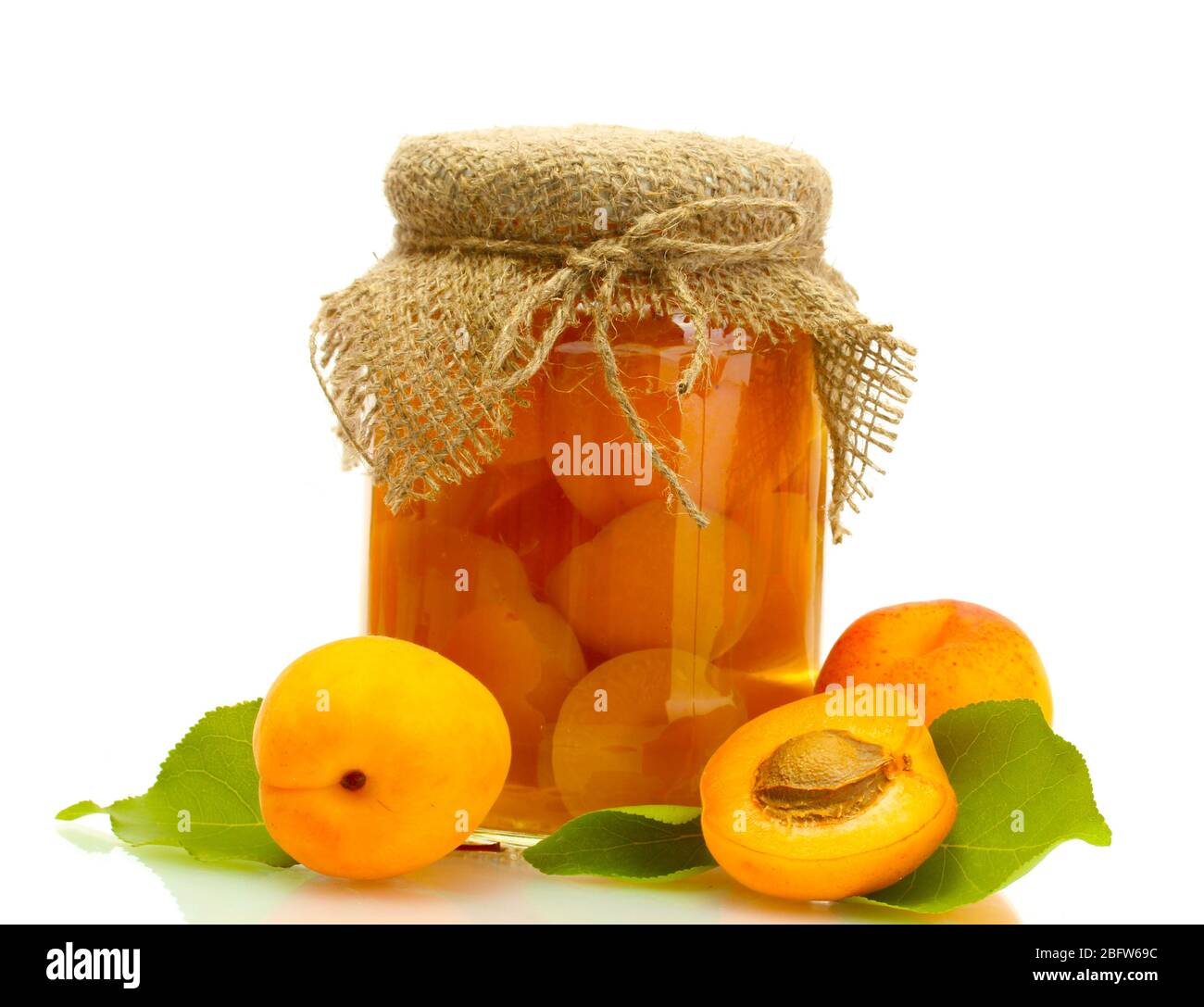 canned apricots in a jar and sweet apricots isolated on white Stock ...