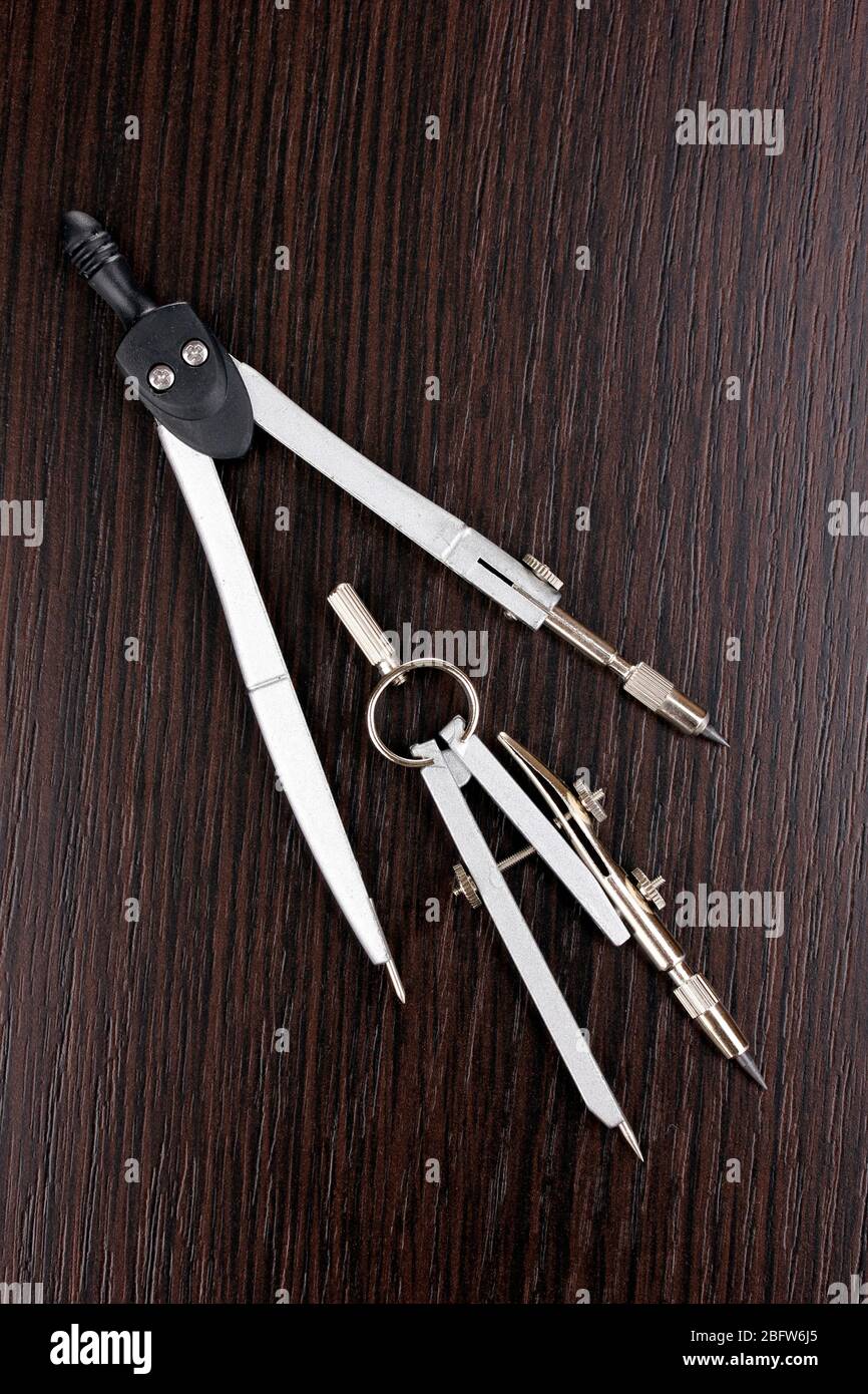 Drafting instruments on wooden background Stock Photo - Alamy