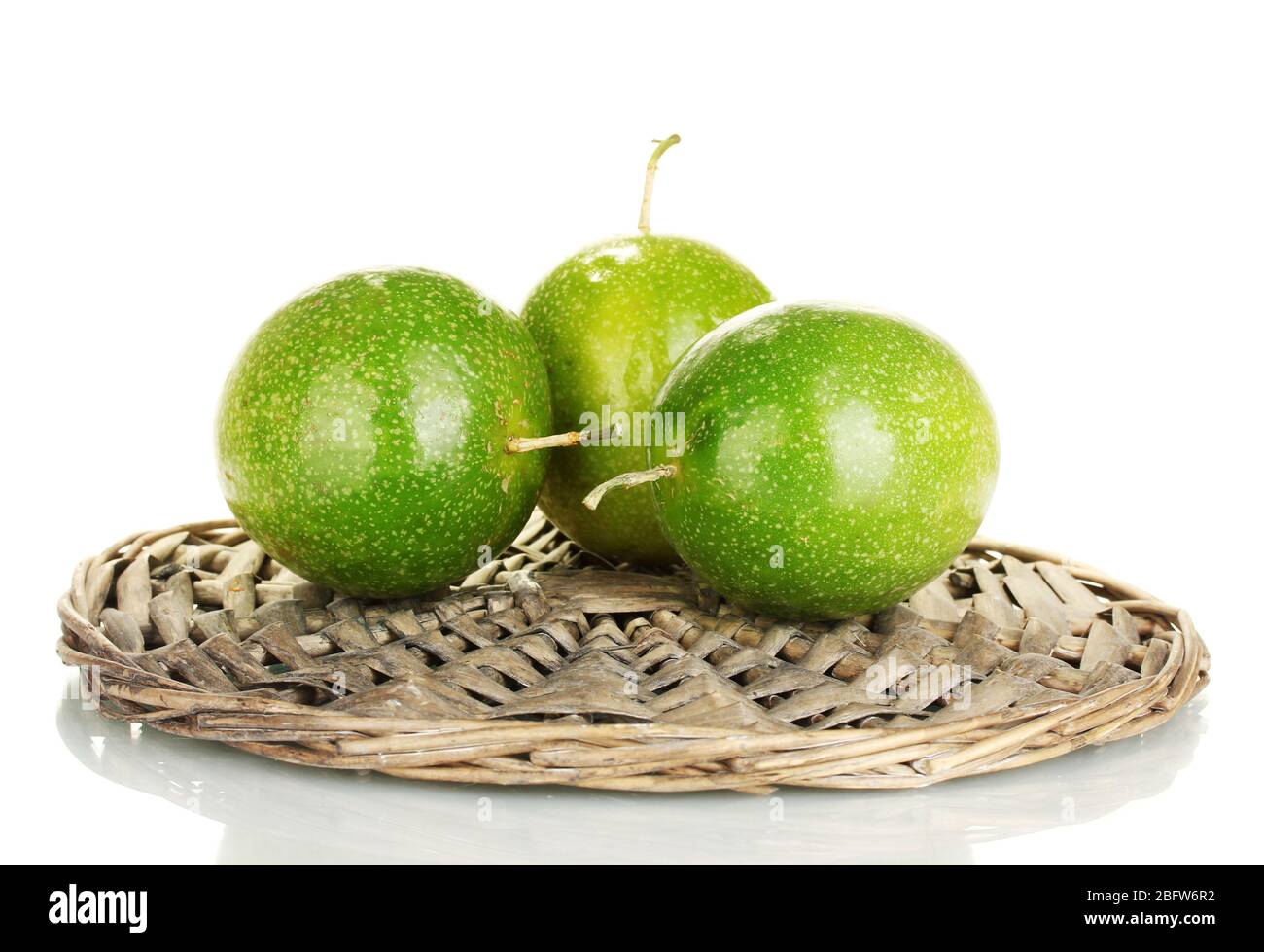 three green passion fruit isolated on white Stock Photo - Alamy
