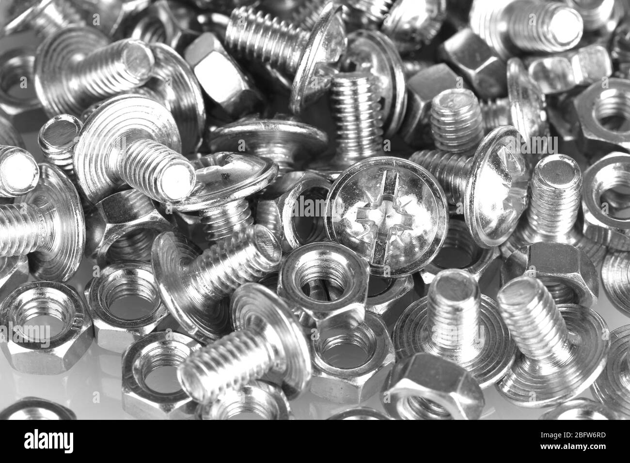 Chrome nuts and bolts close-up Stock Photo - Alamy