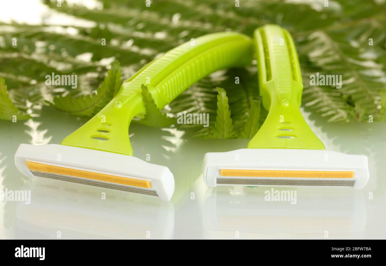 woman safety shavers and leaf isolated on white Stock Photo - Alamy