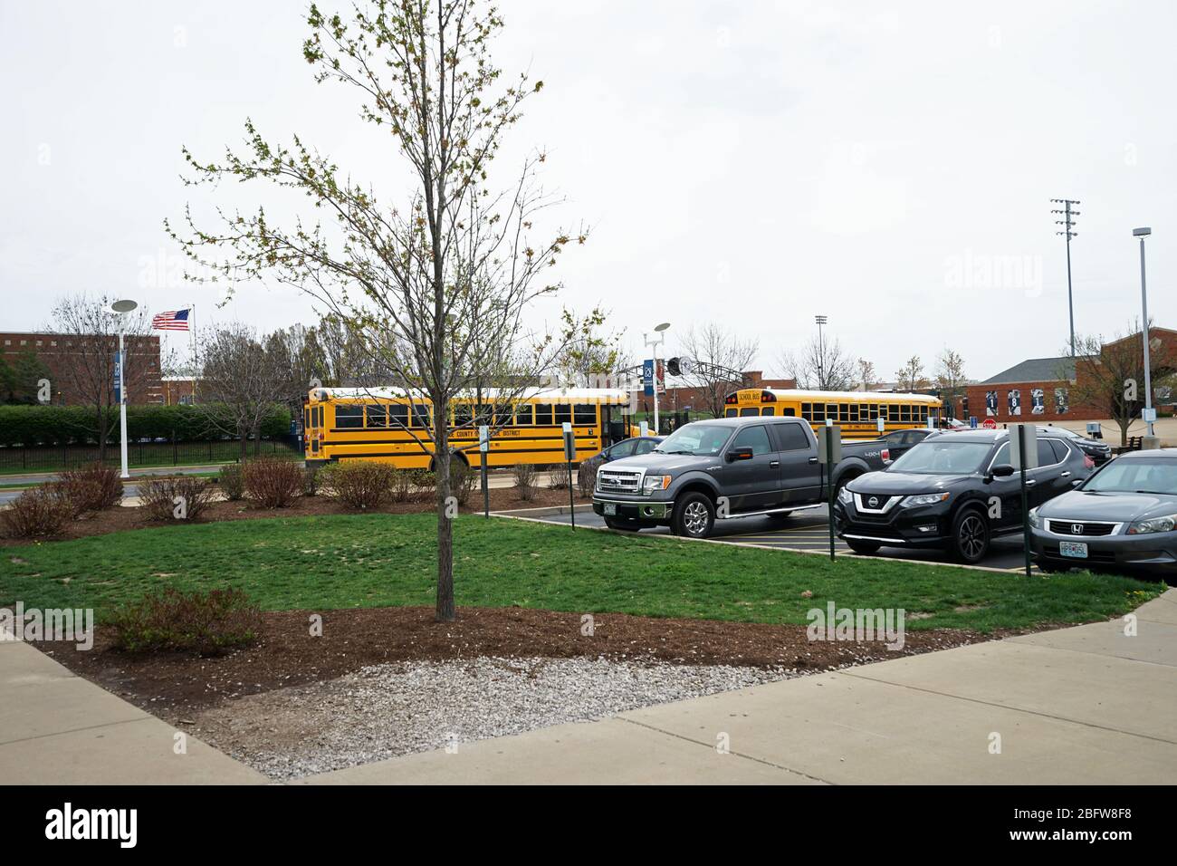Cars and school bus parked at 'Saint Louis Science Center' parking lots ...