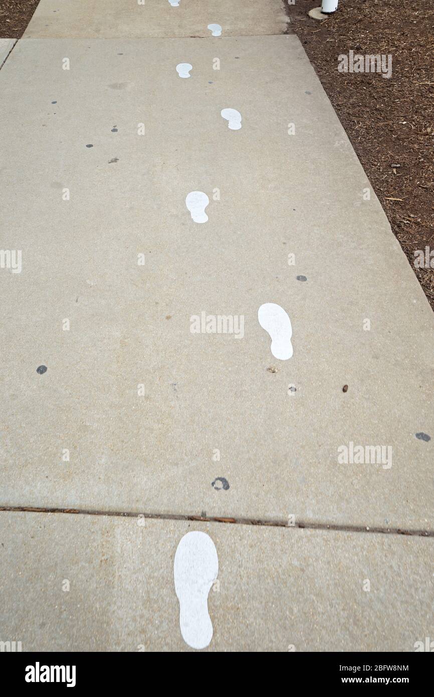 White footprints on cement concrete ground Stock Photo - Alamy