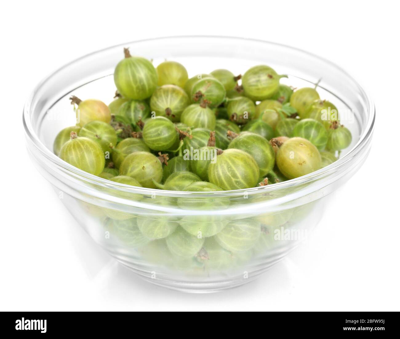 Green gooseberry in glass bowl isolated on white Stock Photo - Alamy