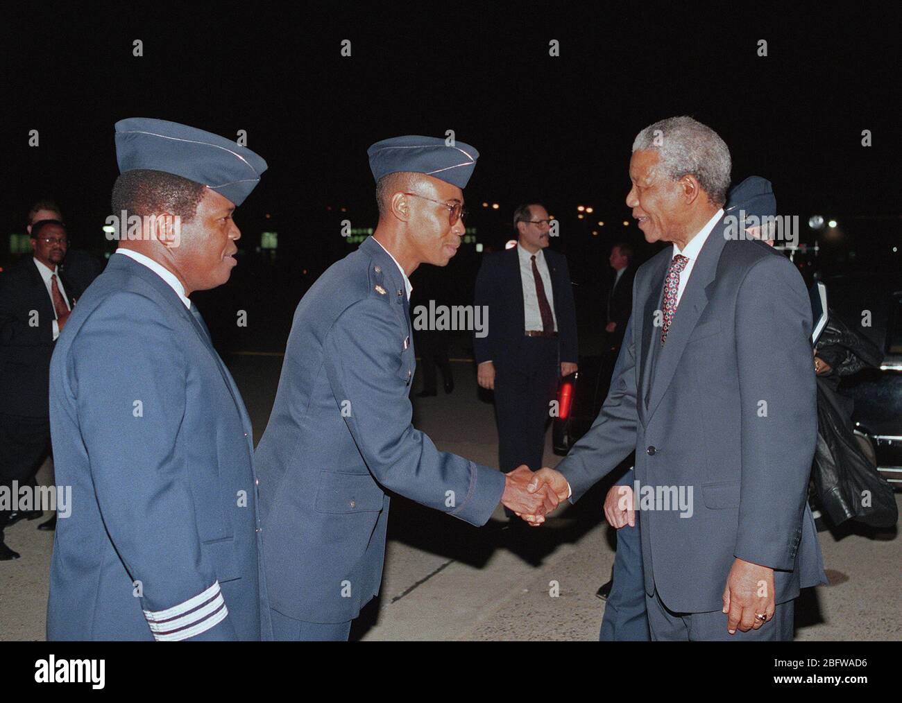 Protocol Officers greet South African President Nelson Mandela on the ...