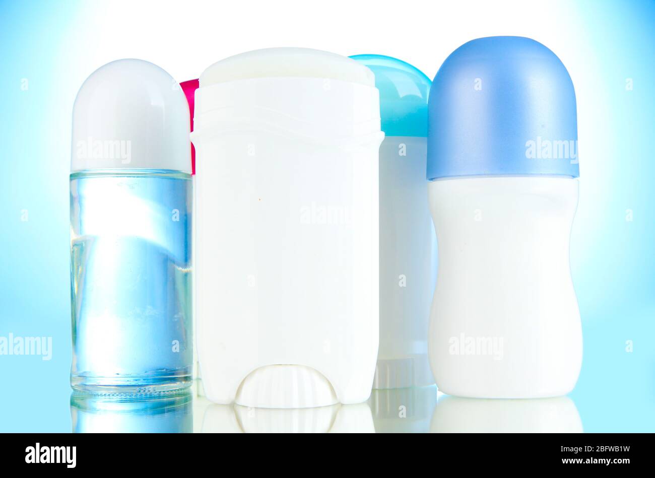 deodorant on blue background Stock Photo - Alamy